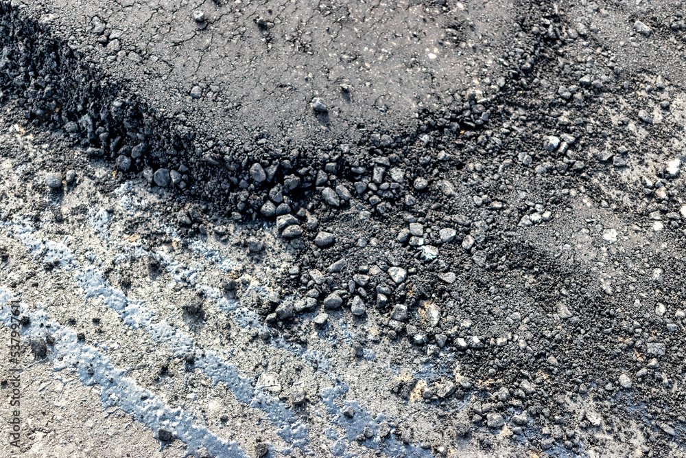 Repair of asphalt pavement of the road. New asphalt on the road. Hot ...