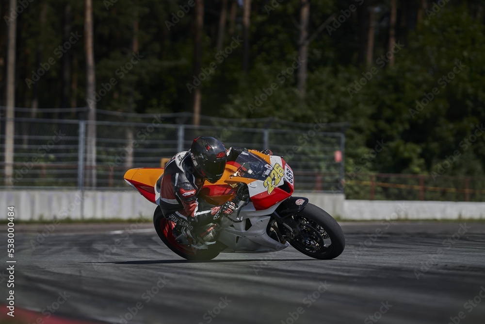 12-09-2022 Riga, Latvia a person riding a motorcycle on a race track, a ...
