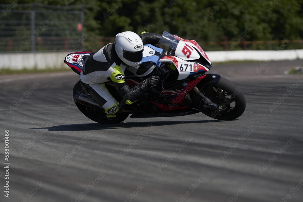 12-09-2022 Riga, Latvia a person riding a motorcycle on a race track, a ...