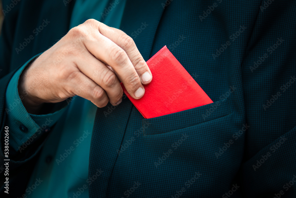 Red identity card. Man With Id Card. Businessman in a blue suit shows ...