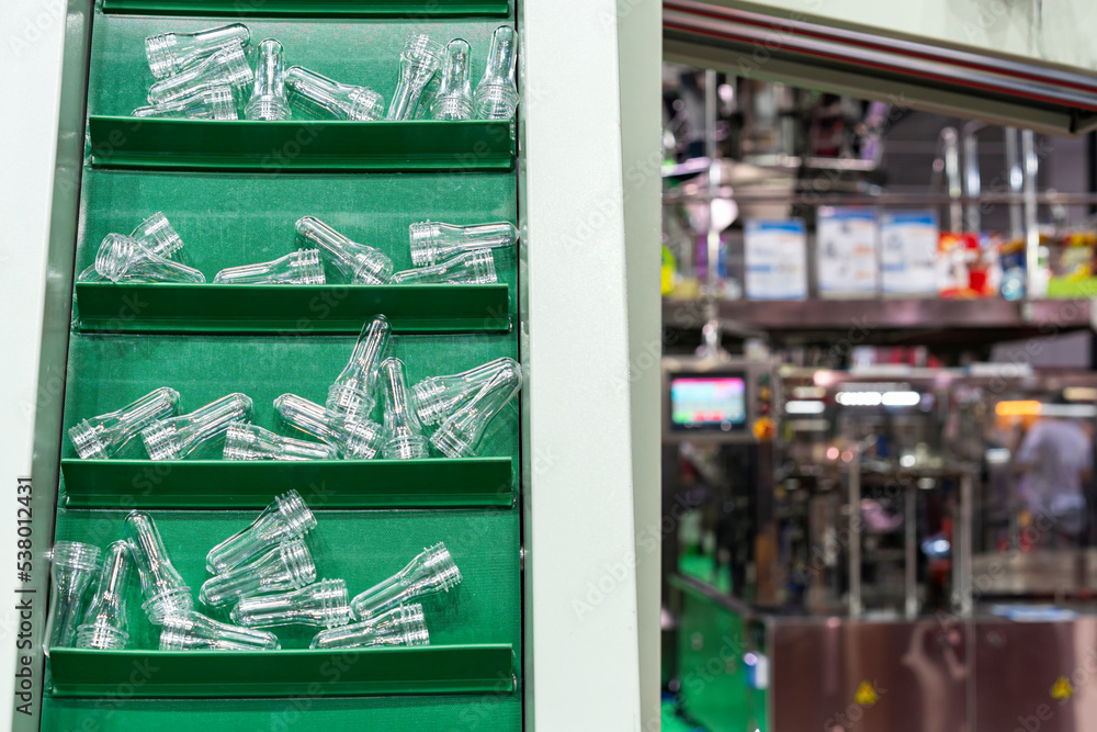 many preform plastic pet clear raw material in metal bucket during ...