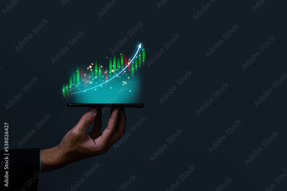 businessman using a smartphone to plan a strategy that shows a positive ...