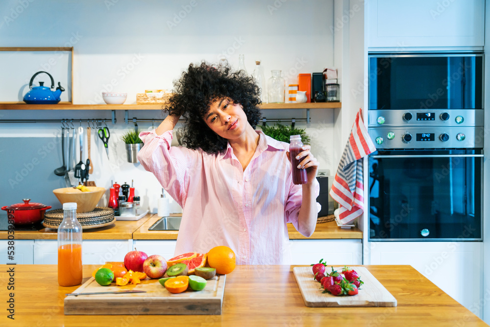 Portrait Of Young Woman Standing By Dining Table Stock Photo | Adobe Stock