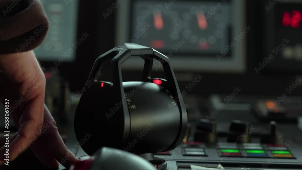 Captain drives ship by azimuth controller. Hand turns joystick of ...