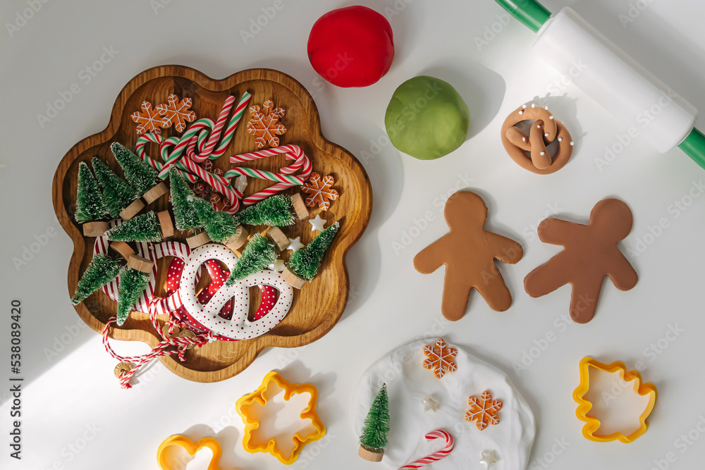 Christmas decorations and crafts with play dough on the table. Holiday ...