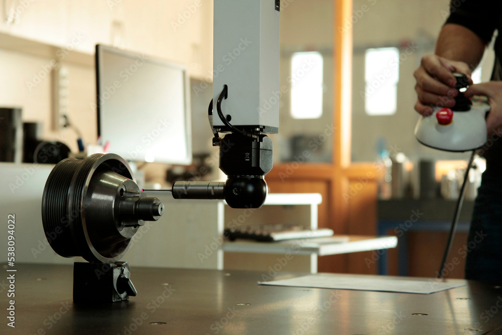 CMM probe measuring on steel cylinder. CMM probe Machine control ...