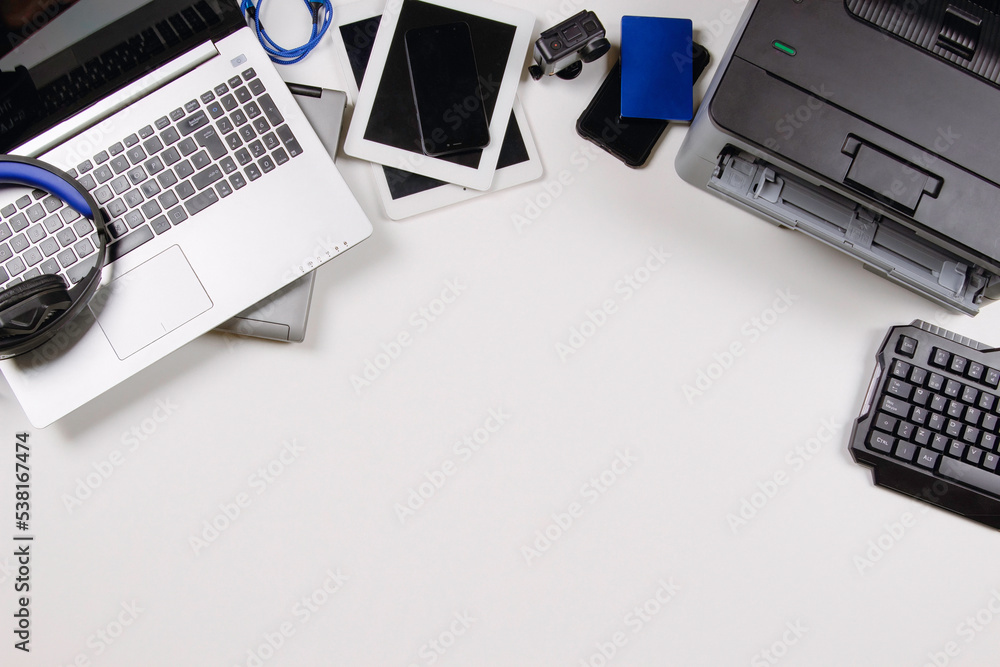 Top view to old laptop computers, digital tablets, mobile smart phones ...