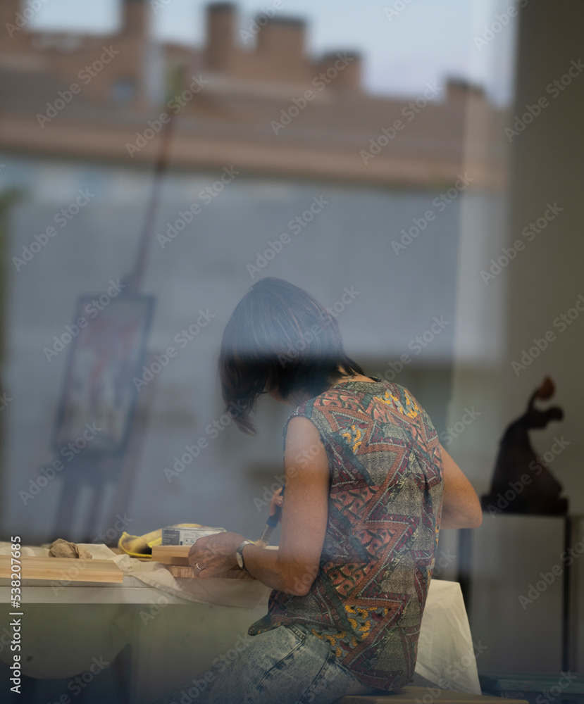 Young female painting at art studio, learning how to draw ...