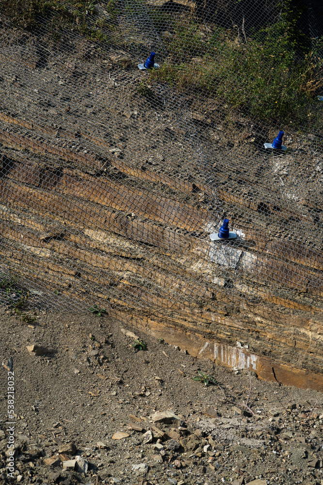 Reinforcing mountain slope with metal mesh and concrete reinforcement ...