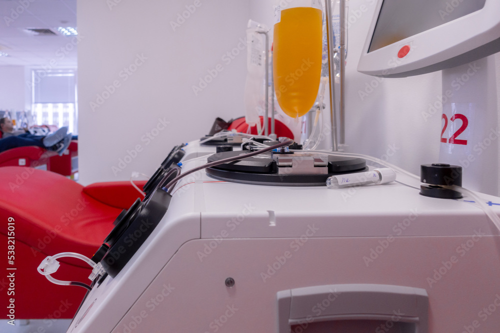 A bag of blood plasma hangin on a device for plasma separation ...