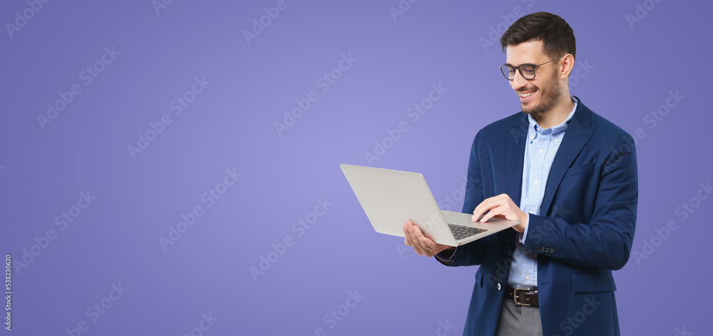 Horizontal banner of handsome smiling business man holding laptop ...