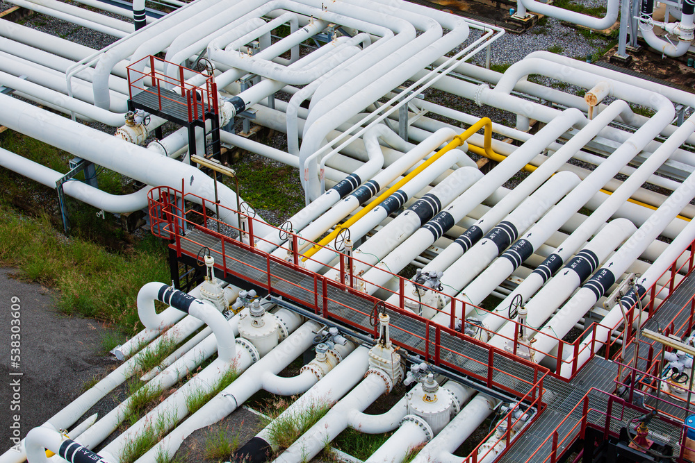 Photo & Art Print Steel long pipes and pipe elbow in station oil ...