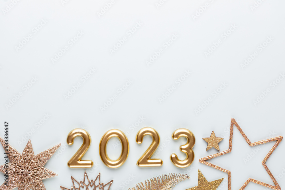 New year 2023 number, golden digits and santa hat over blue background ...