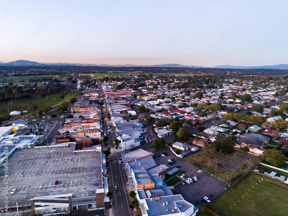Drone view of almost empty carpark and main street in country town of ...
