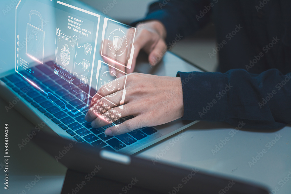 Man using laptop computer,shield,padlock icon,concept internet network ...