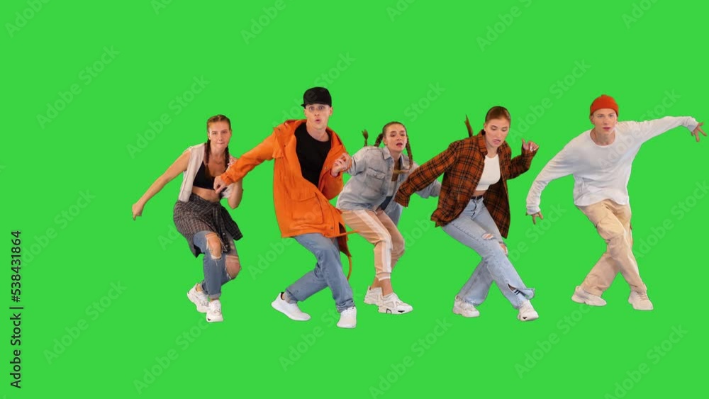 Group of street dancers dancing moving in sync on a Green Screen ...