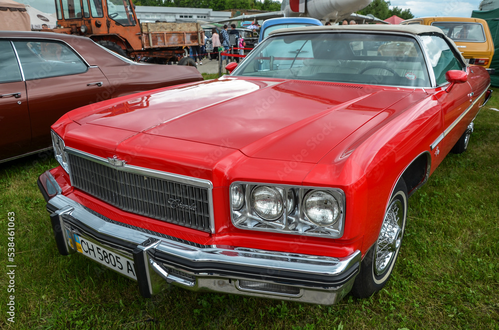 Red Chevrolet Impala Convertible 1975, length over 5 meters, under the ...