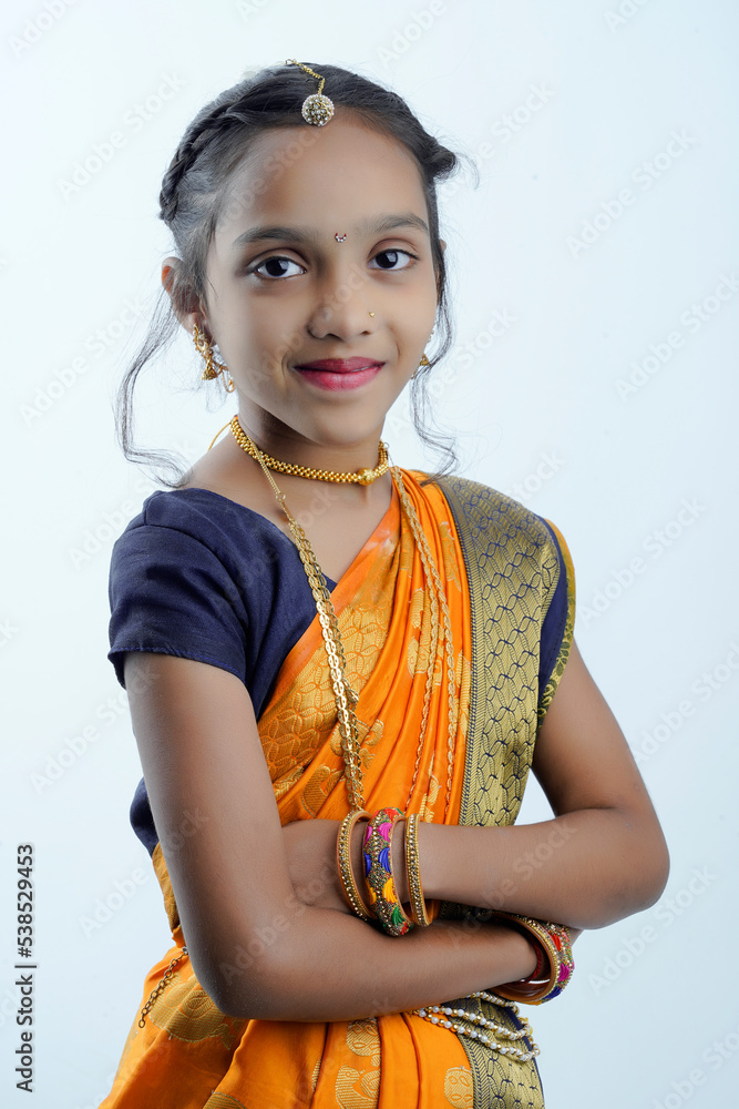 indian marathi little girl in traditional blue navwari saree on white ...