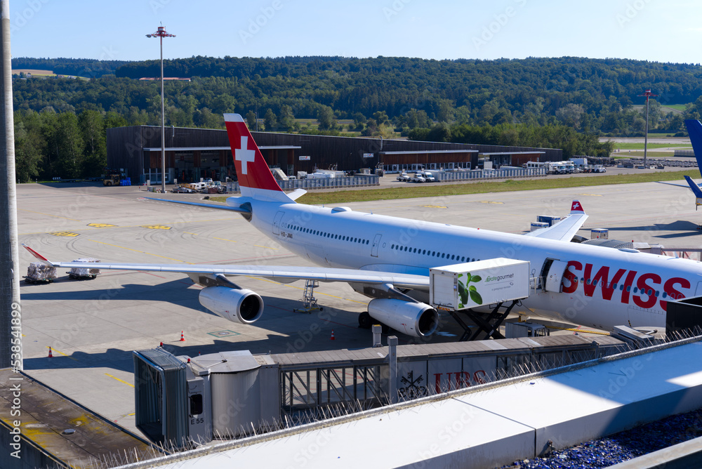 Tail of parked airplane Swiss Airbus A340-300 register HB-JMI at Dock ...