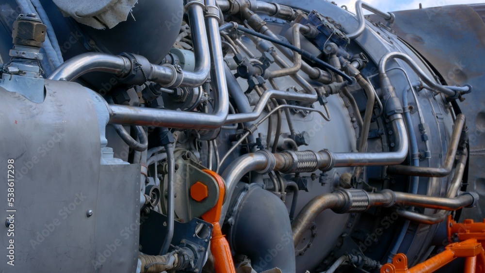 Mechanic engine expert shows the design of a helicopter engine, the ...