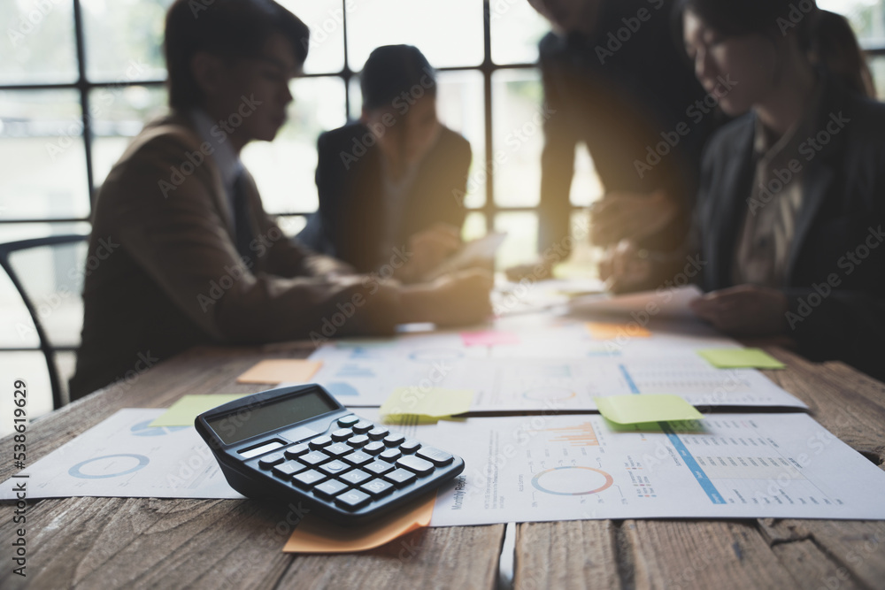 business people group meeting about Finance charts and graphs papers ...