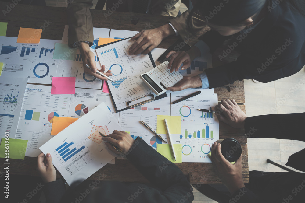 business people group meeting about Finance charts and graphs papers ...