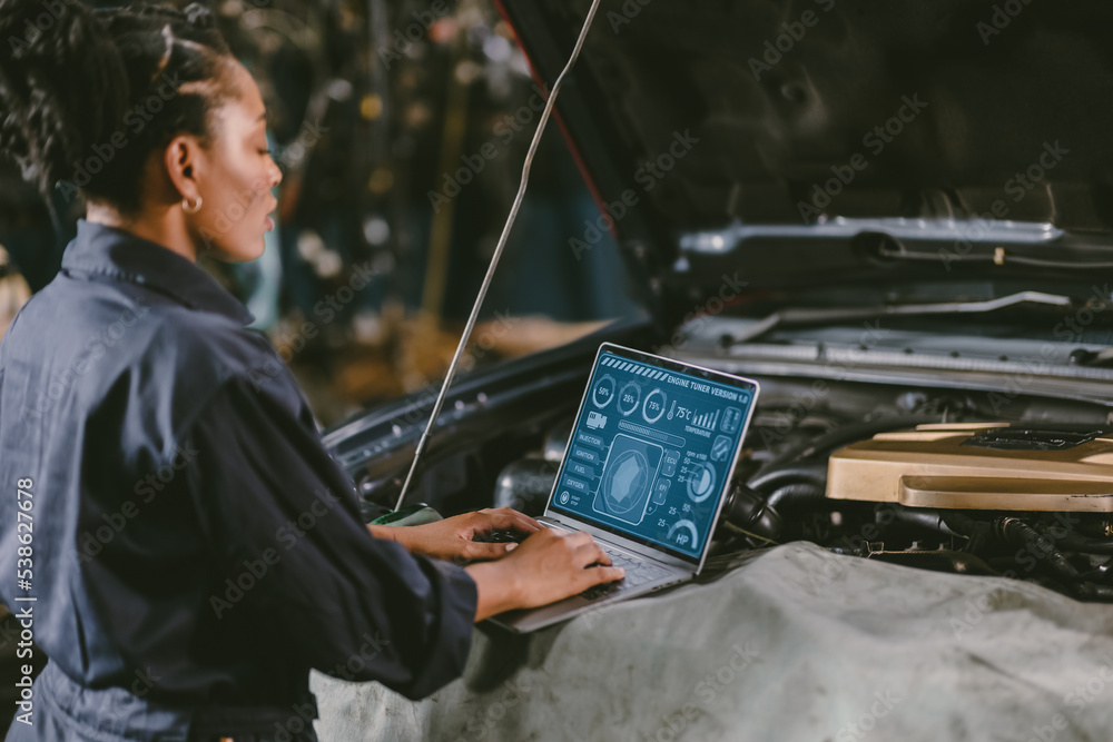 garage mechanic car engine engineer woman staff worker using laptop ...