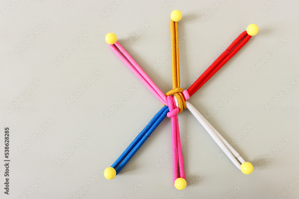 Concept image of unity and teamwork. Ropes tied together as a symbol of ...