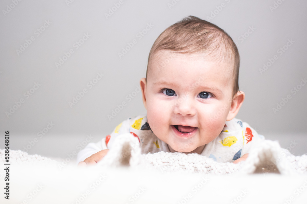 baby in prone position happy smiling Stock Photo | Adobe Stock