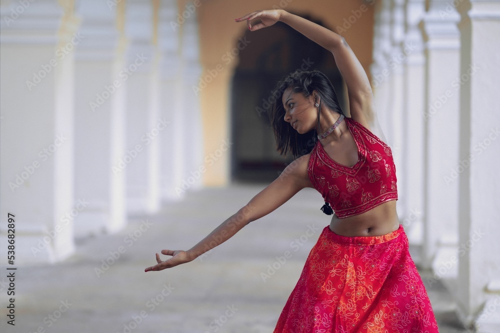 Indian yogini in among white columns Stock Photo | Adobe Stock