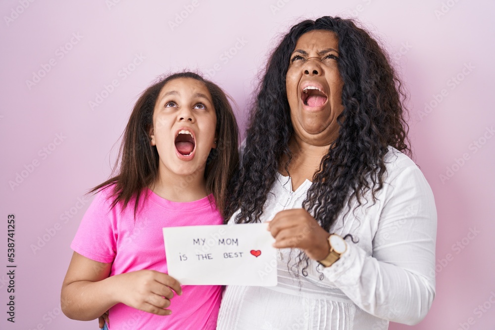 Mother and young daughter holding my mom is the best banner angry and ...
