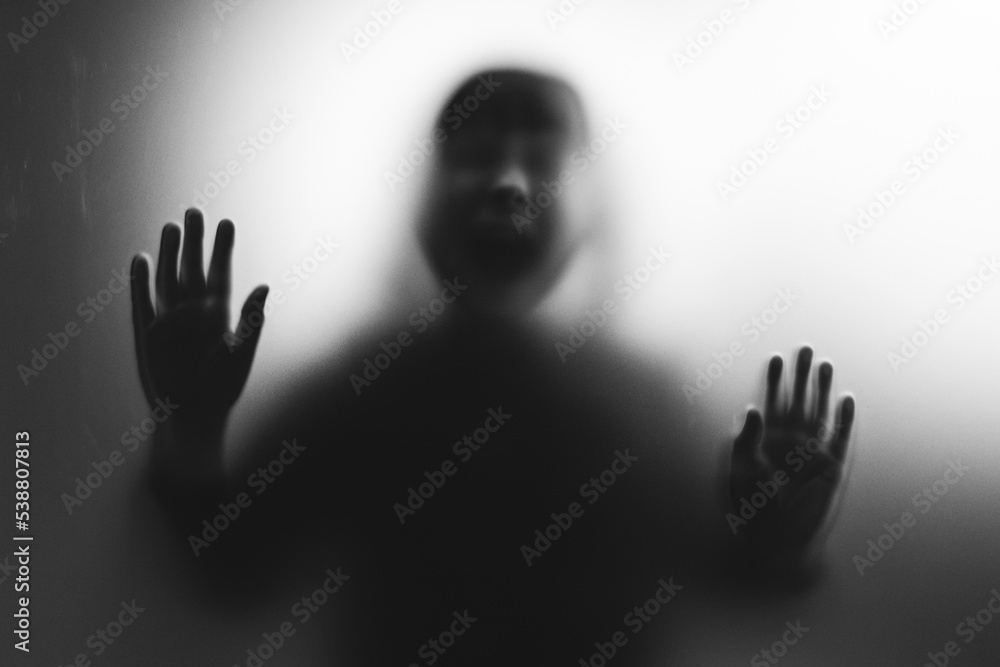 Shadowy figure, child behind glass - horror background Stock Photo ...