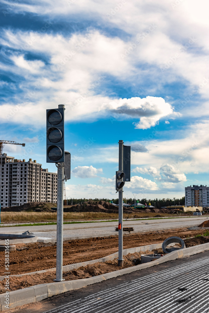 Installation of group traffic lights during the construction of a new ...