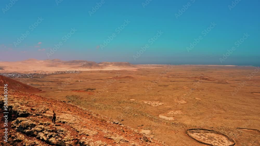 Spectacular aerial view. Unrecognizable tourists walk along edge of ...