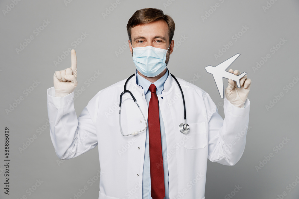 Male doctor man wear white medical gown suit mask work in hospital hold ...