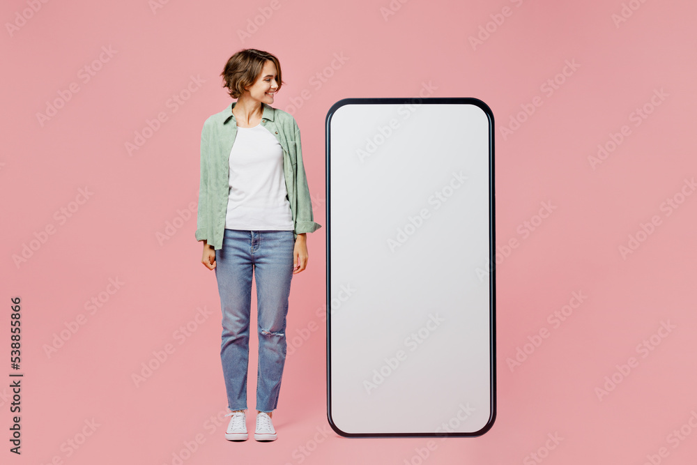 Full body young smiling fun woman wear green shirt white t-shirt look ...