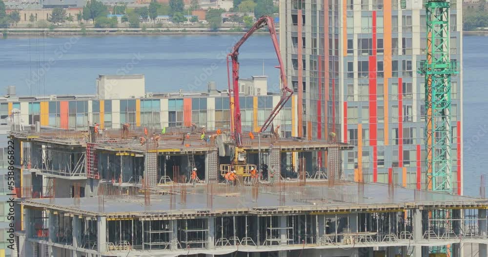 Construction time lapse. Builders are building a multi-storey building ...