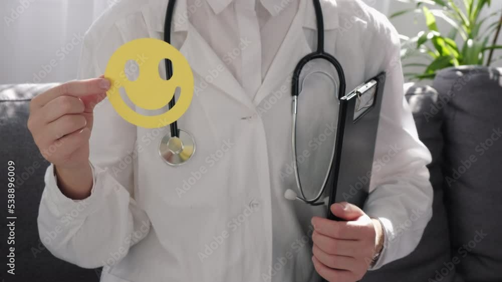 Stockvideo Close up of professional female doctor in white coat with ...