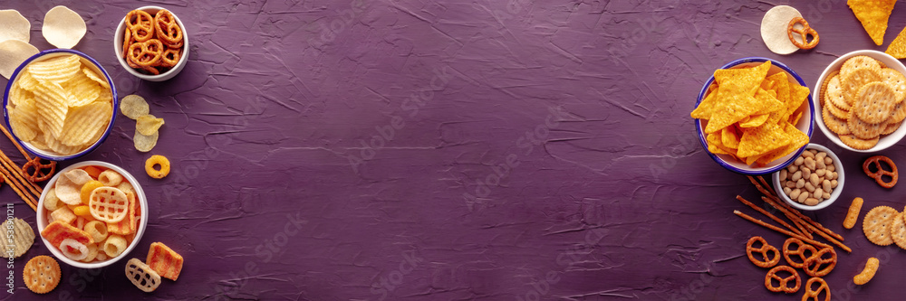 Party food background. Salty snacks panorama. A table of assorted ...