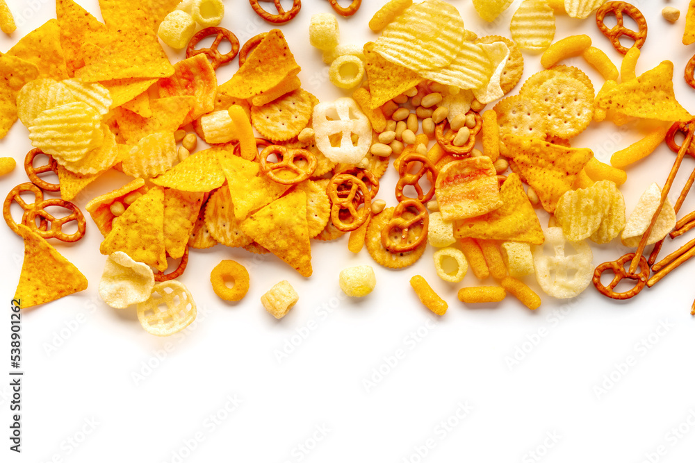 Salty snacks on white. Potato and tortilla chips, salt crackers etc ...