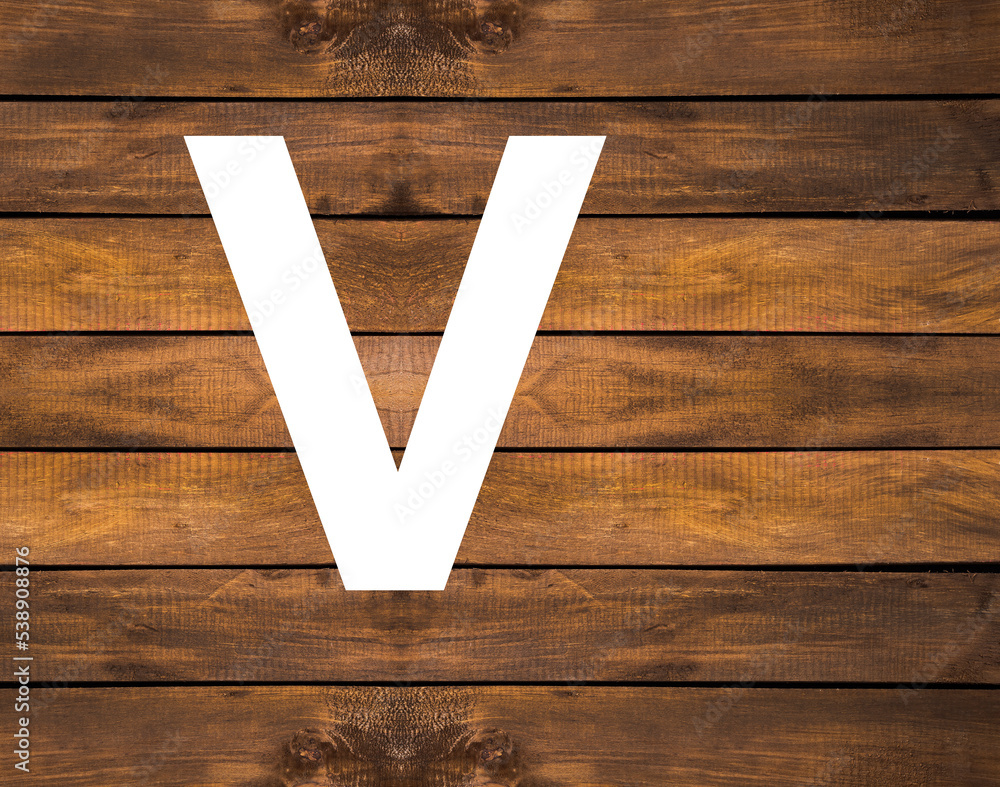 V capital letter of alphabet in white hole on wood background Stock ...
