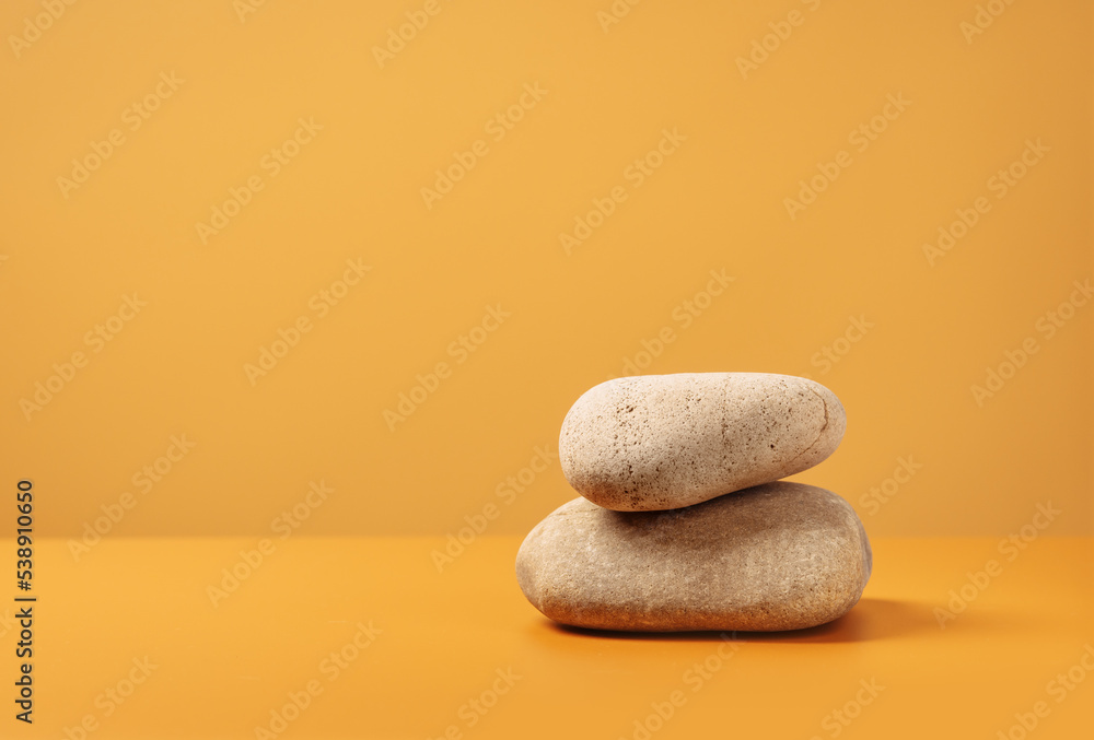 Mockup scene with stones on a yellow background. Natural pedestal for ...