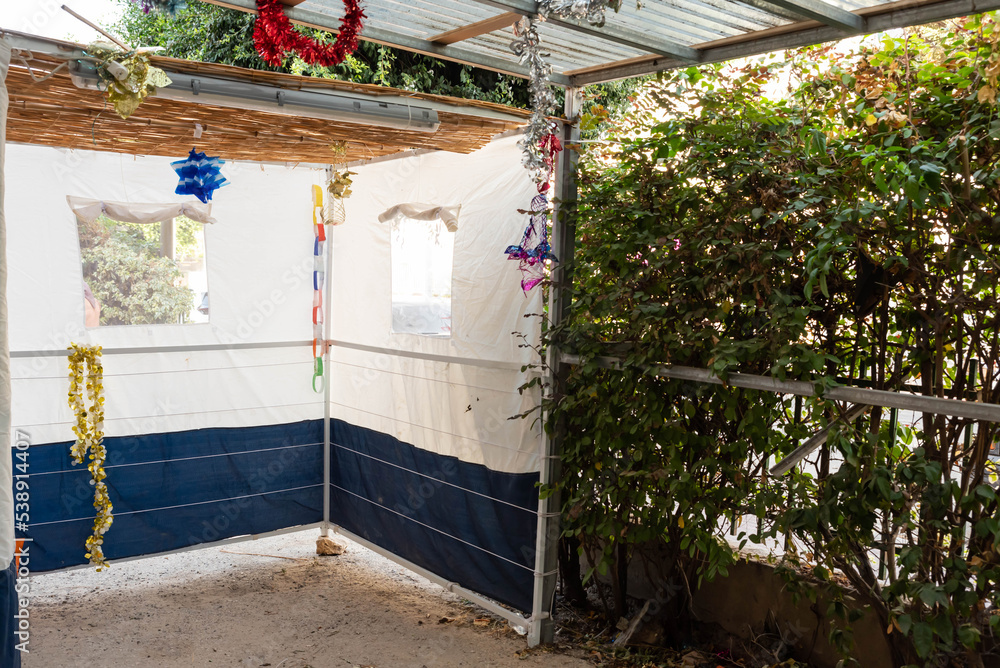 Jewish festival of Sukkot in Israel. Traditional sukkah with handmade ...