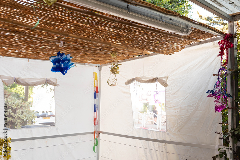 Jewish festival of Sukkot in Israel. Traditional sukkah with handmade ...