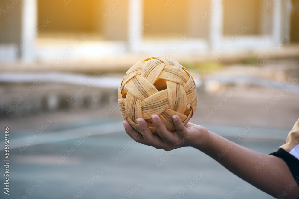 Sepak takraw ball, southeast asian countries traditional sport, holding ...