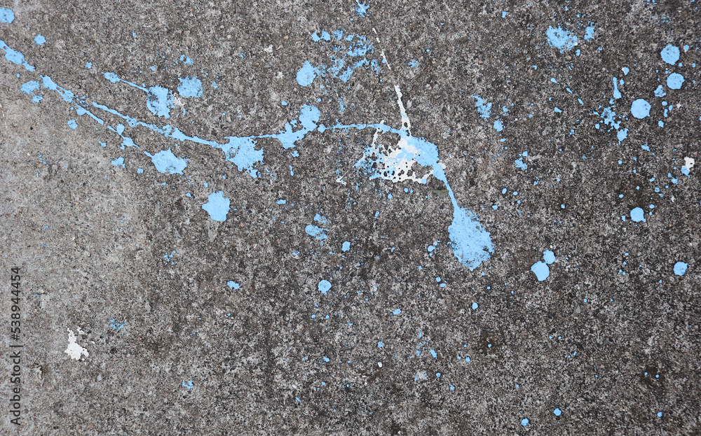 Dripping paint on the concrete floor of walking street way during color ...