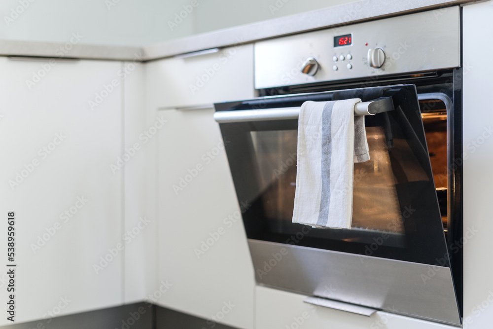 electric built-in oven with open door at modern kitchen Stock Photo ...