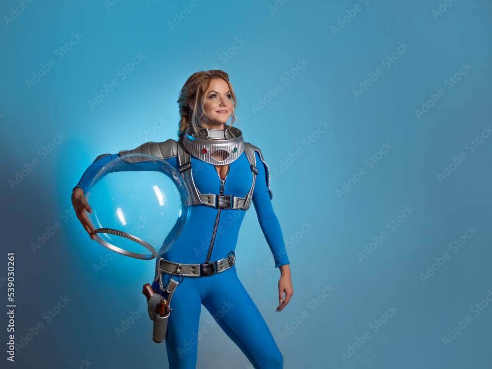 Fantastic astronaut costume in retrofuturism style. A young beautiful ...