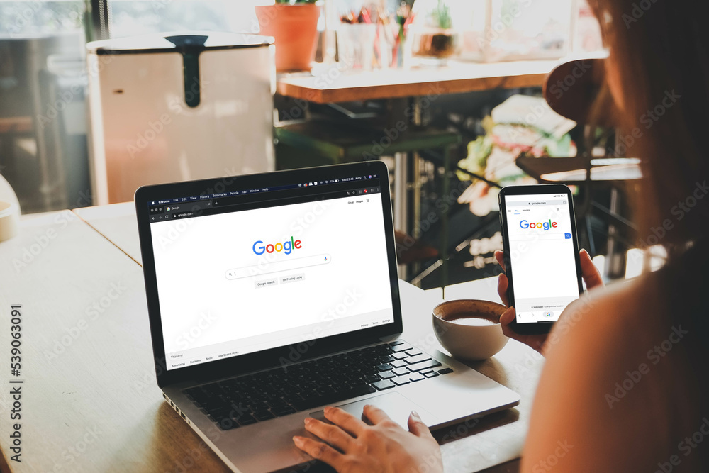 Bangkok. Thailand. October 19,2022: A woman is typing on Google search ...