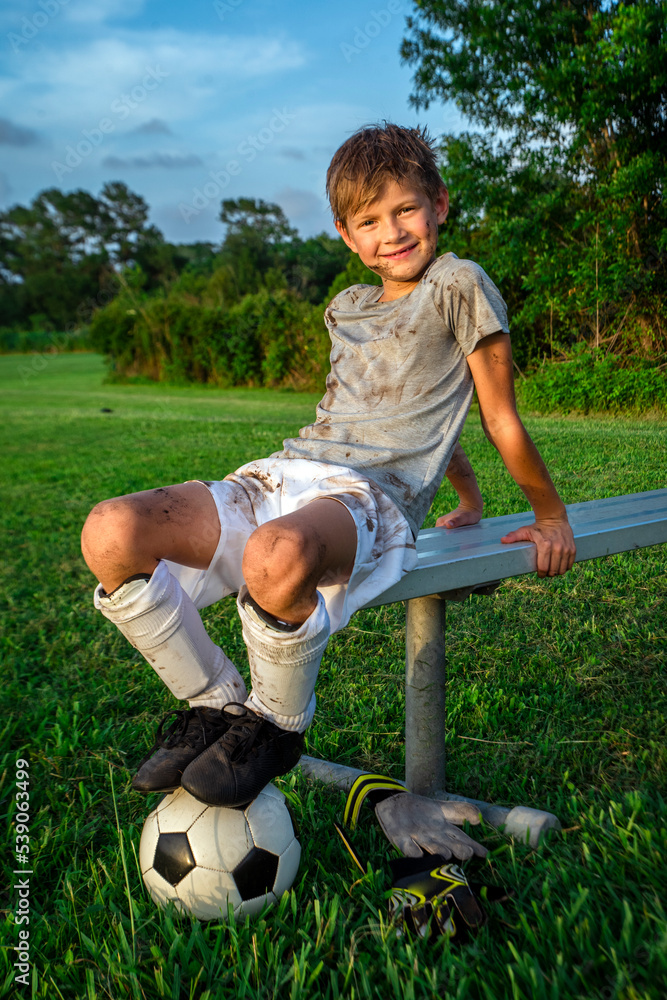 Youth Child Boy Soccer Player Sitting on Bench With Soccer Ball Stock ...